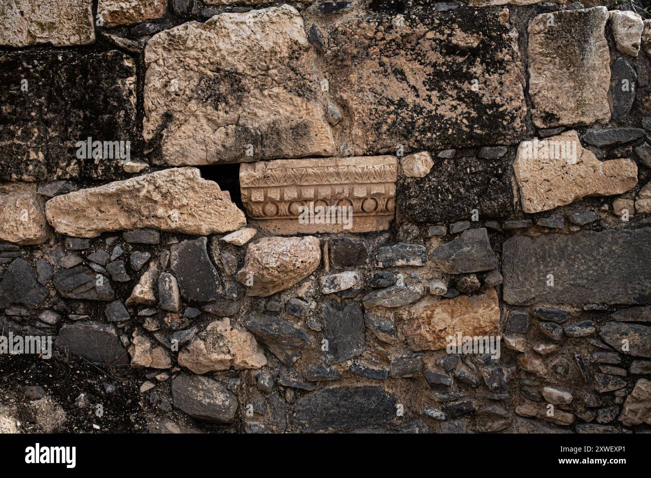 A detailed view of an ancient Jewish artifact embedded in the stone ...