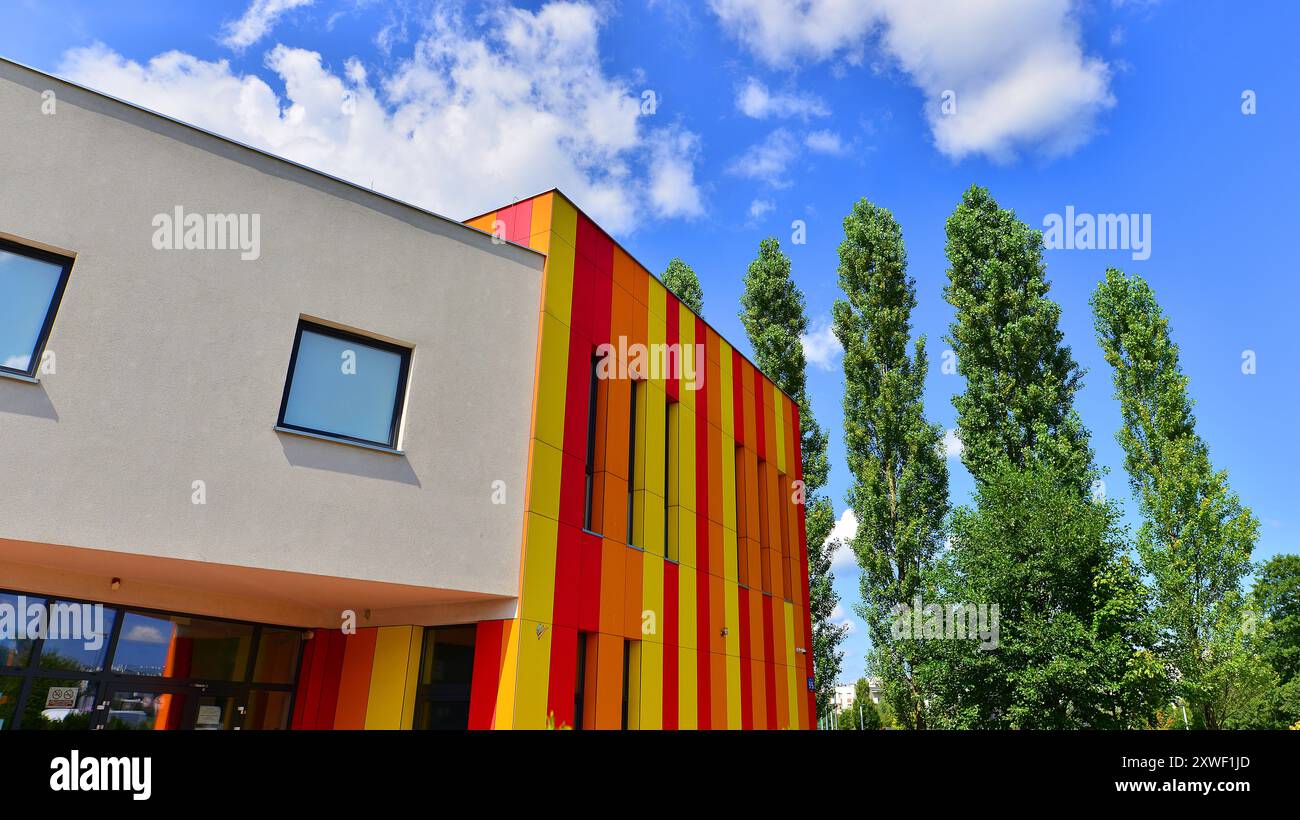 Modern office building facade fragment with colorful vertical panels ...