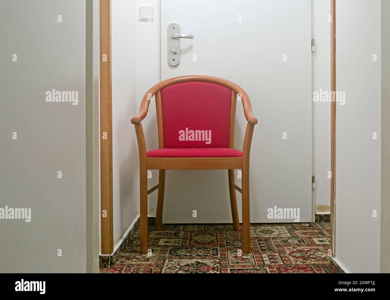 Chair being used to secure a door and stop it being opened Stock Photo ...
