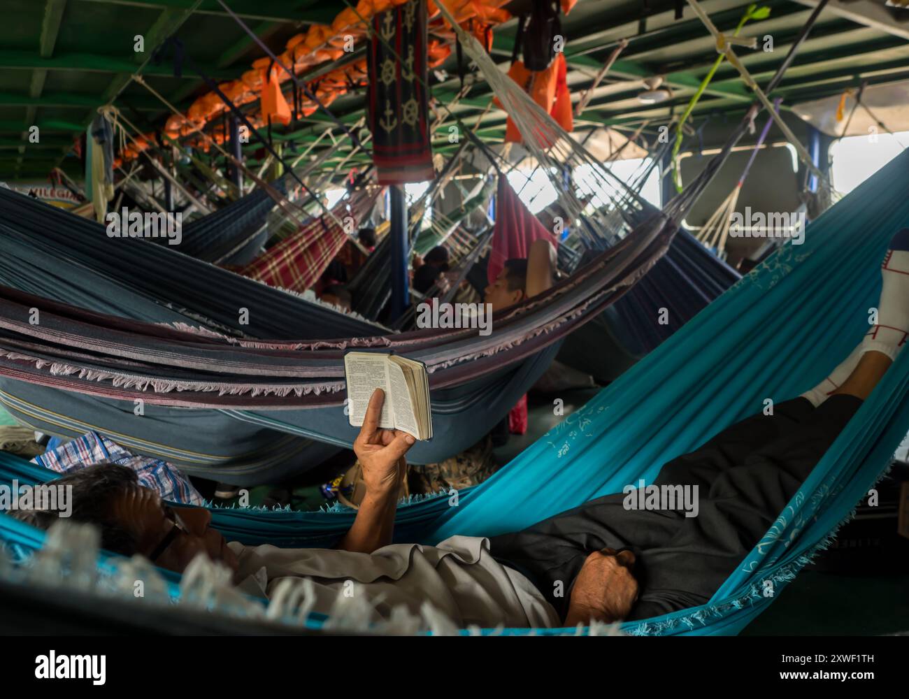 Amazon River, Peru - Decemberr 9, 2019: Man praying while laying on ...