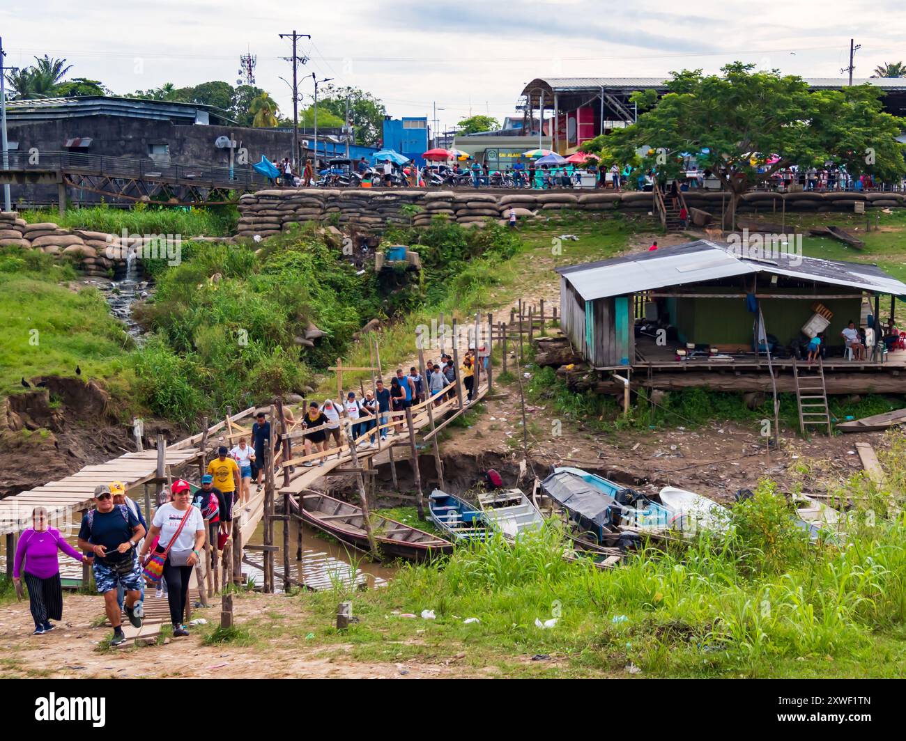 Leticia, Colombia – Dec 8, 2022: Wooden bridge to the small village on ...
