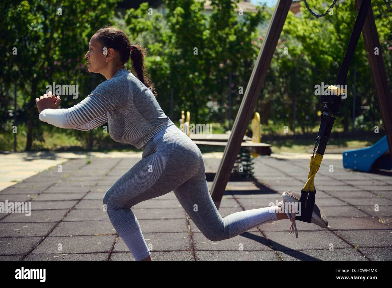 Trainer demonstrating core strengthening hi-res stock photography and ...
