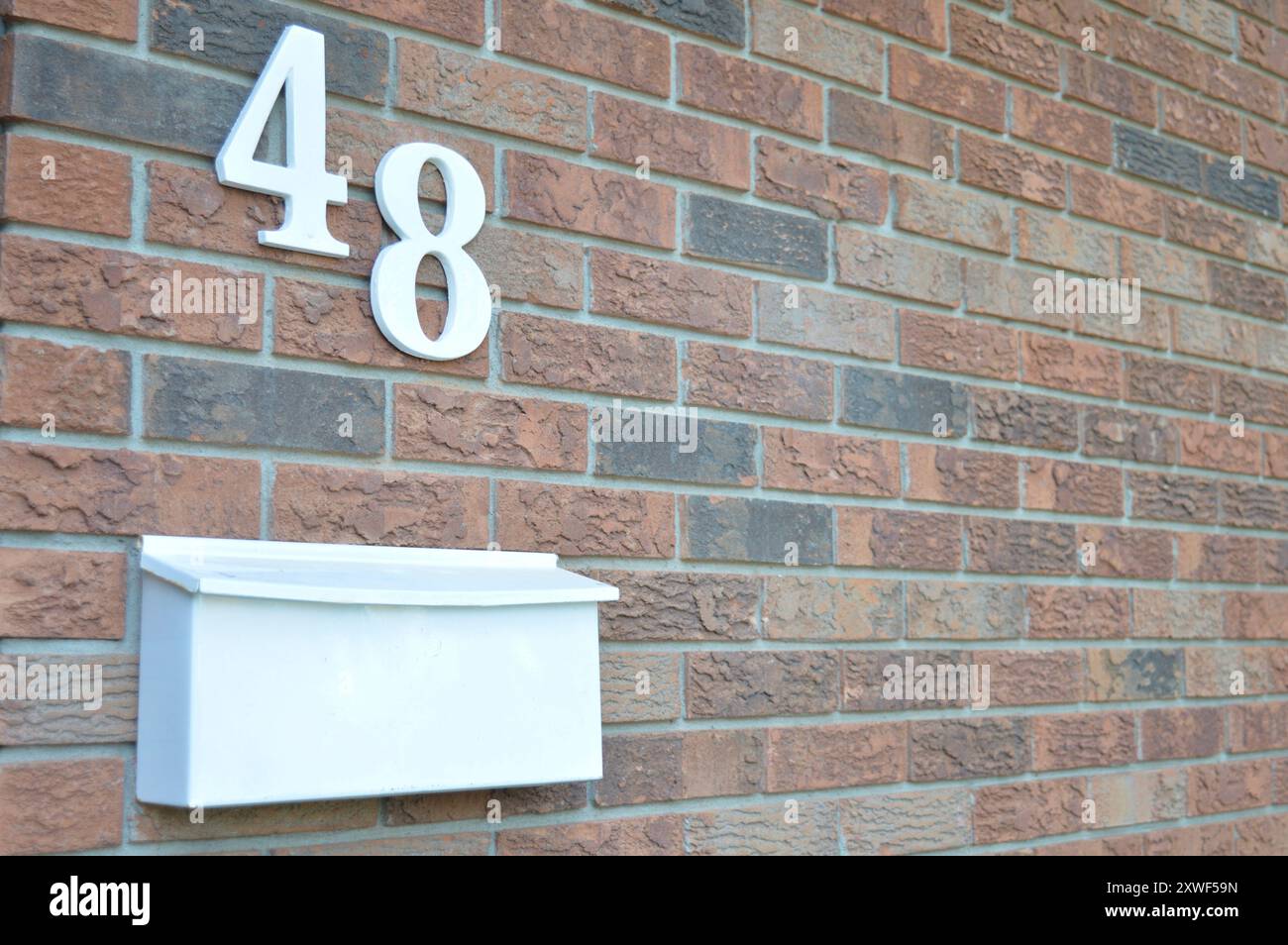 Front entrance to a house with a mail box Stock Photo - Alamy