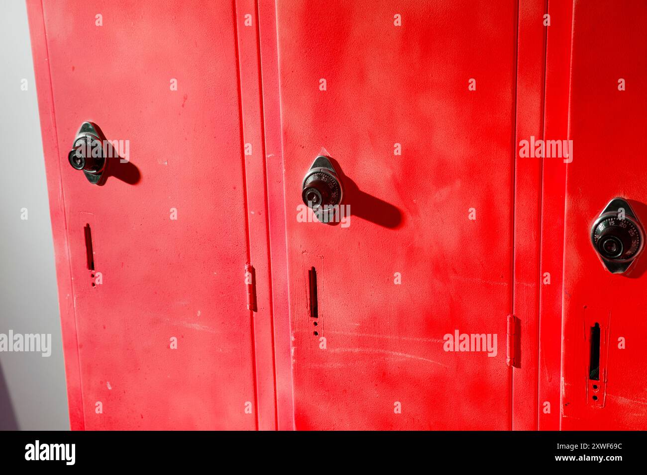 A view of a set of red colored lockers Stock Photo - Alamy