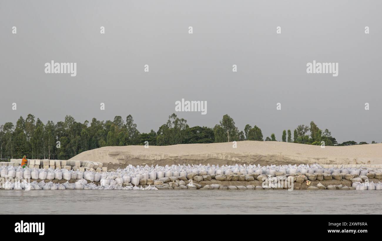 Flood barriers and levees built up with huge sand bags and concrete ...