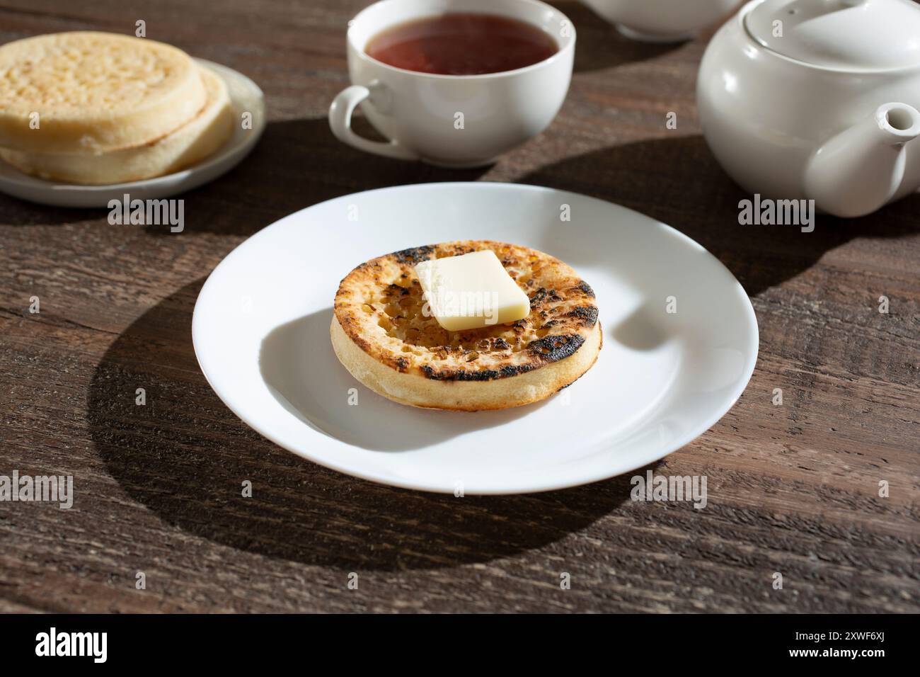 A view of a crumpet and tea set Stock Photo - Alamy