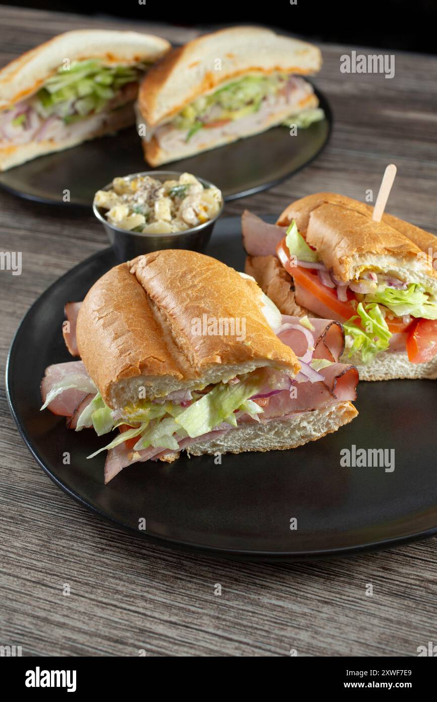 A view of plates of sandwiches, featuring a ham sandwich Stock Photo ...