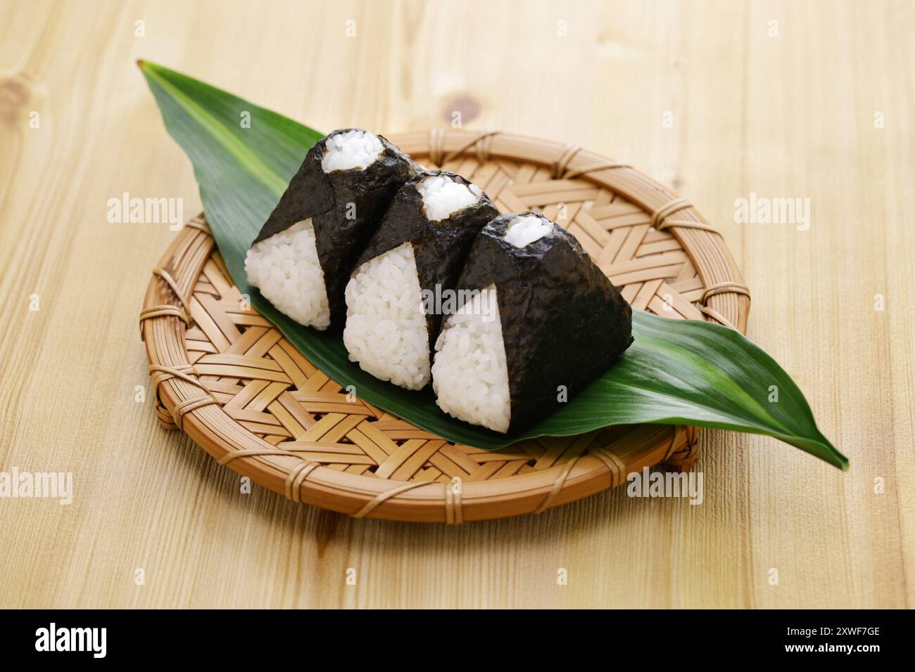 homemade onigiri (rice balls), traditional Japanese food. The filling is salmon flakes, umeboshi ...