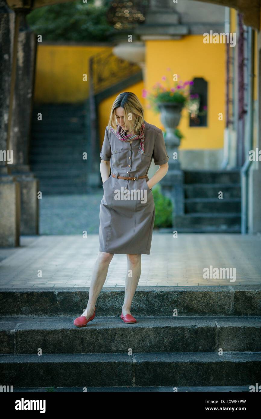 Woman walking through charming hi-res stock photography and images - Alamy