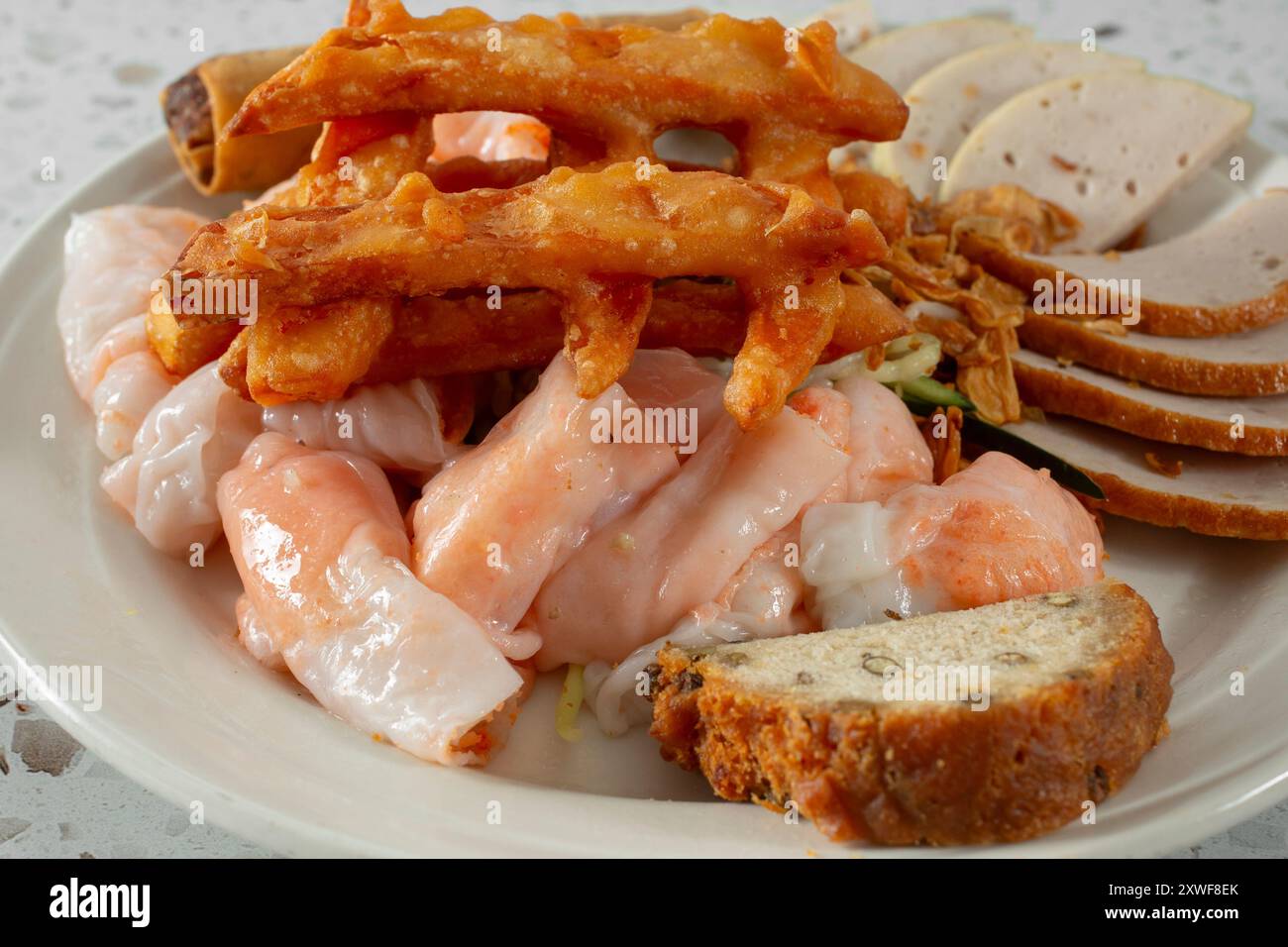 A closeup view of a plate of banh cuon tom Stock Photo - Alamy