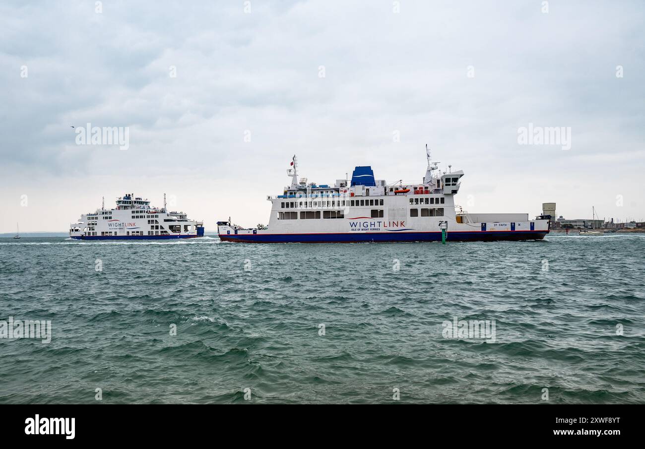 e of Wight car ferries passing each other in Portsmouth harbour Stock ...