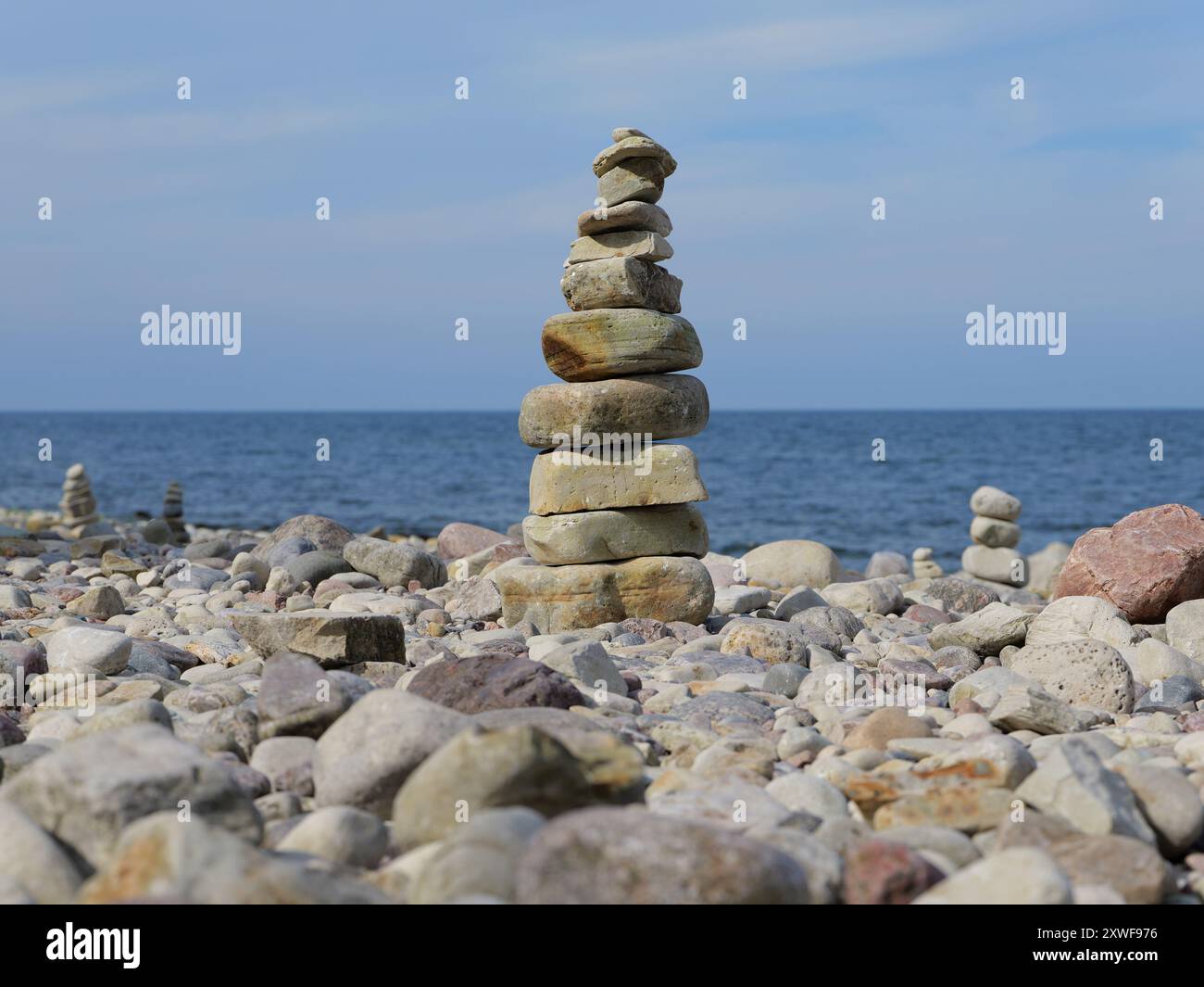 Stacked stones to form towers and figures on the beach are popular ...