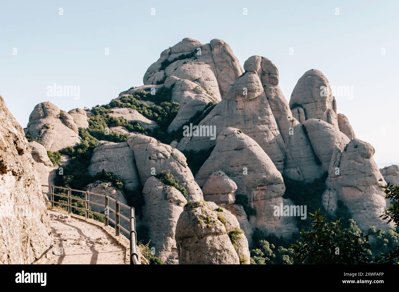 Scenic trail path through the majestic stone formations of Montserrat ...