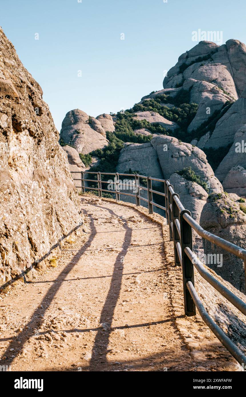 Scenic trail path through the majestic peaks of Montserrat Stock Photo ...