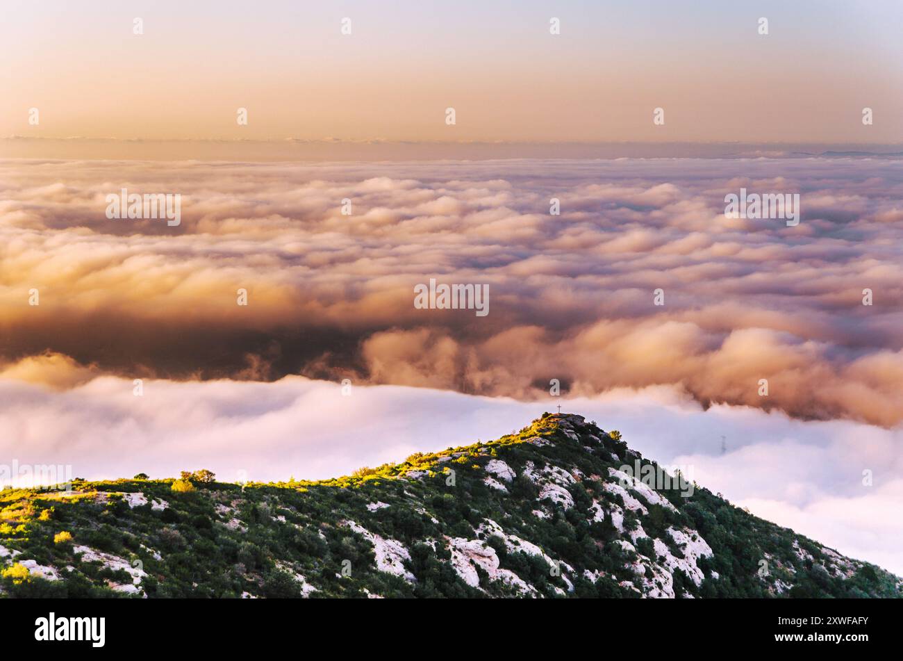 Textures and layers: Montserrat mountain cliff with a sea of clouds and ...
