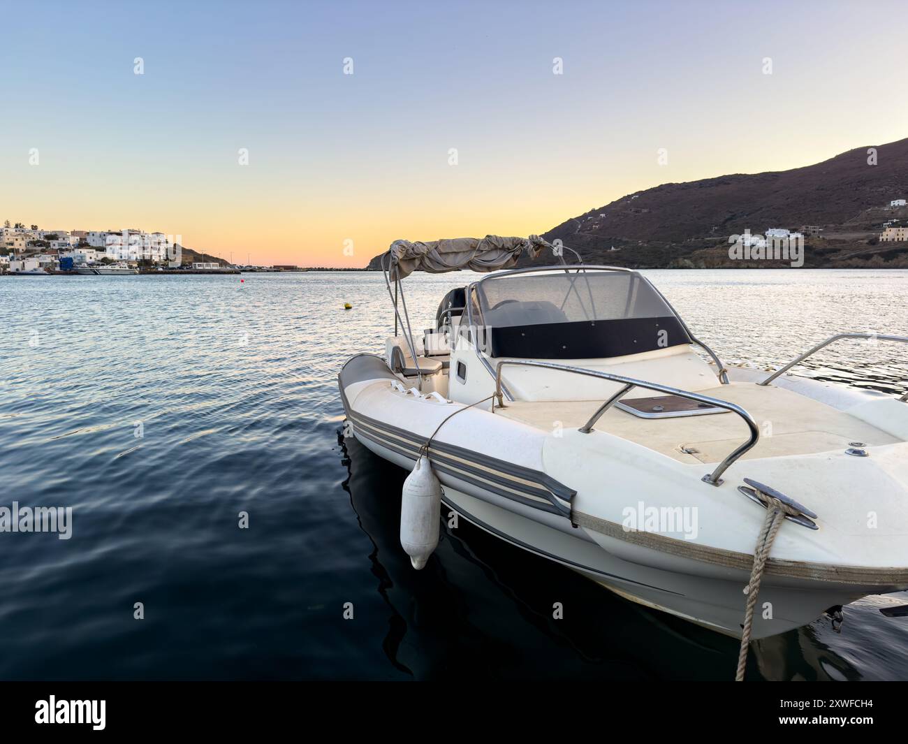 Andros island, Cyclades Greece. Inflatable boat moored and waterfront ...