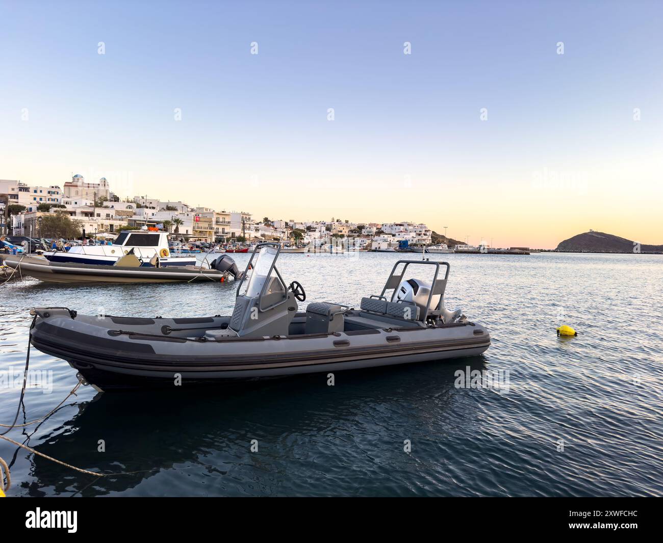 Andros island, Cyclades Greece. Inflatable boats moored and waterfront ...