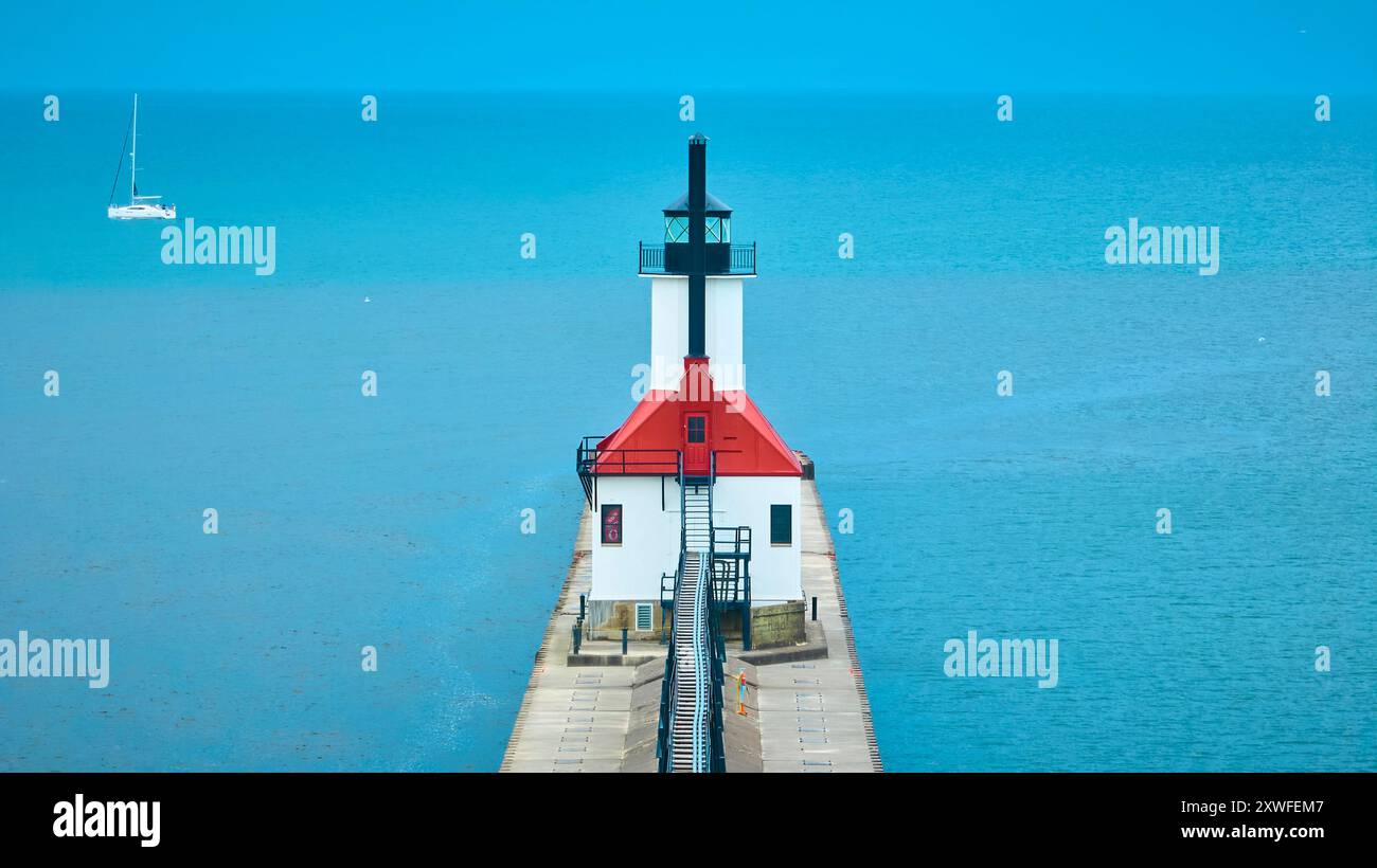 Aerial View of St. Joseph North Pier Lighthouse and Sailboat on Lake ...