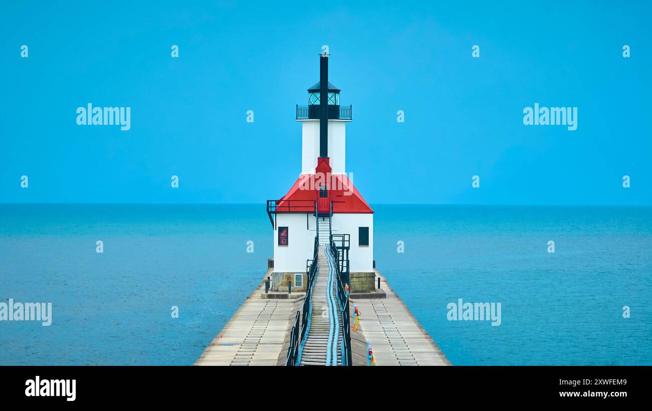 Aerial View of Red-Roofed Lighthouse on Pier Extending into Lake ...