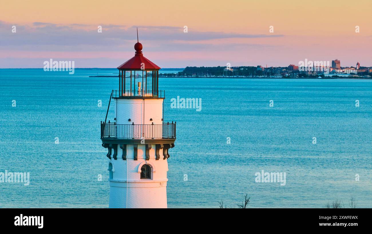 Aerial Fly Through Wind Point Lighthouse at Sunset Over Lake Michigan ...