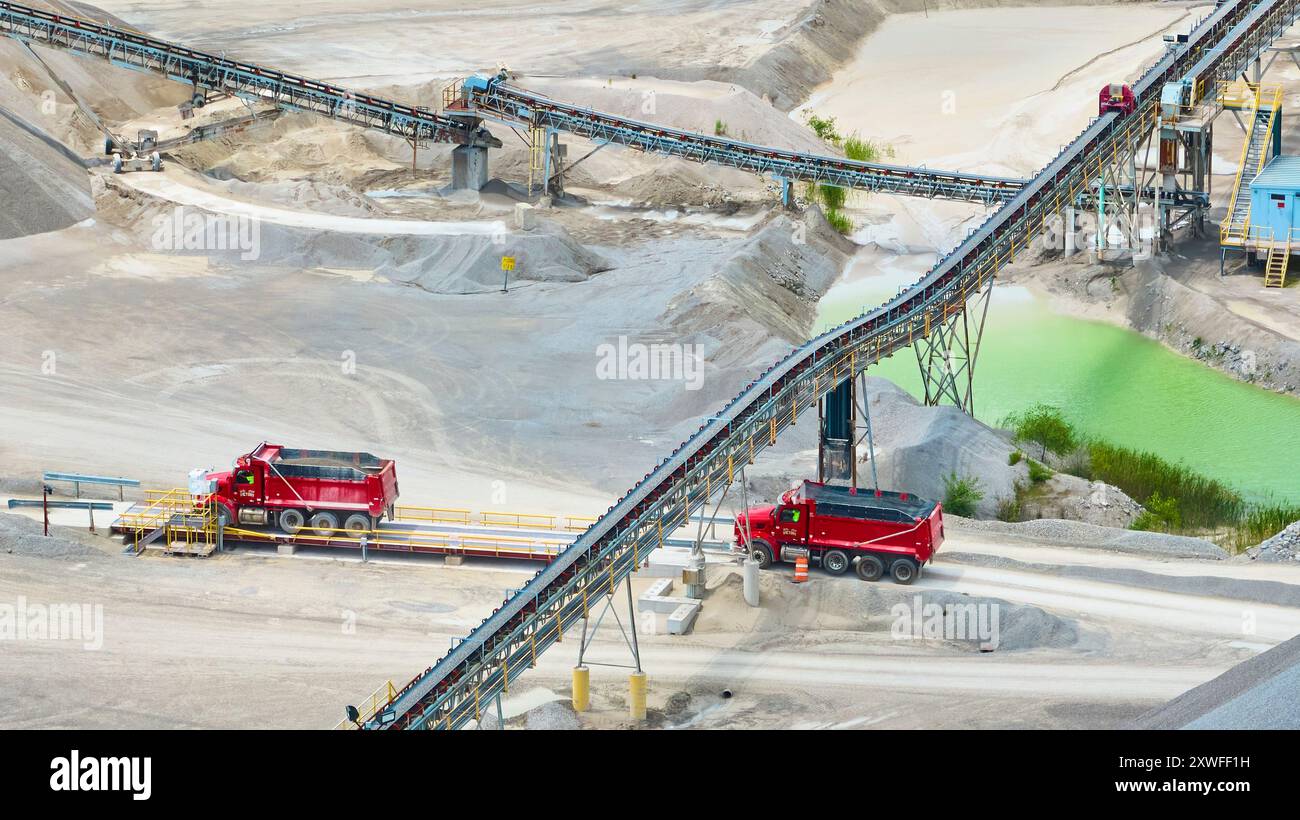 Aerial View of Quarry with Red Dump Trucks and Conveyor Belts Stock ...