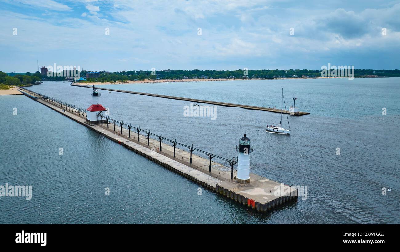 Aerial View of North Pier Lighthouse and Sailboat on Lake Michigan ...