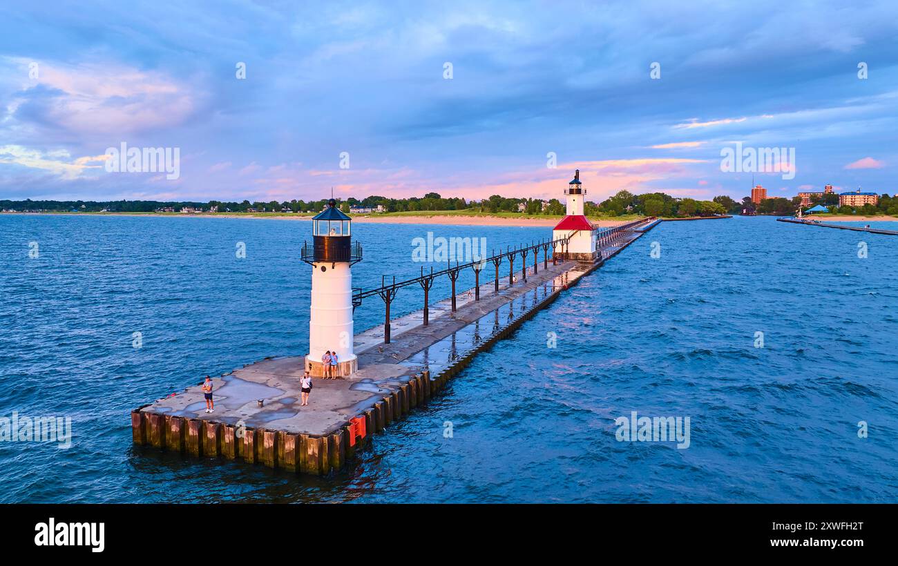 Aerial View of Twin Lighthouses on Pier at Golden Hour Stock Photo - Alamy