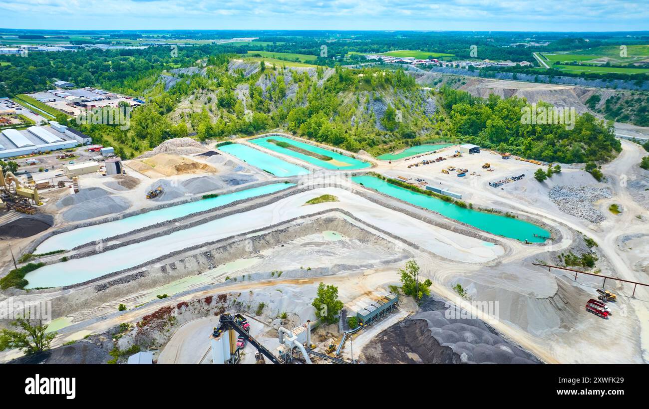 Aerial Quarry with Turquoise Water and Heavy Machinery in Rural ...
