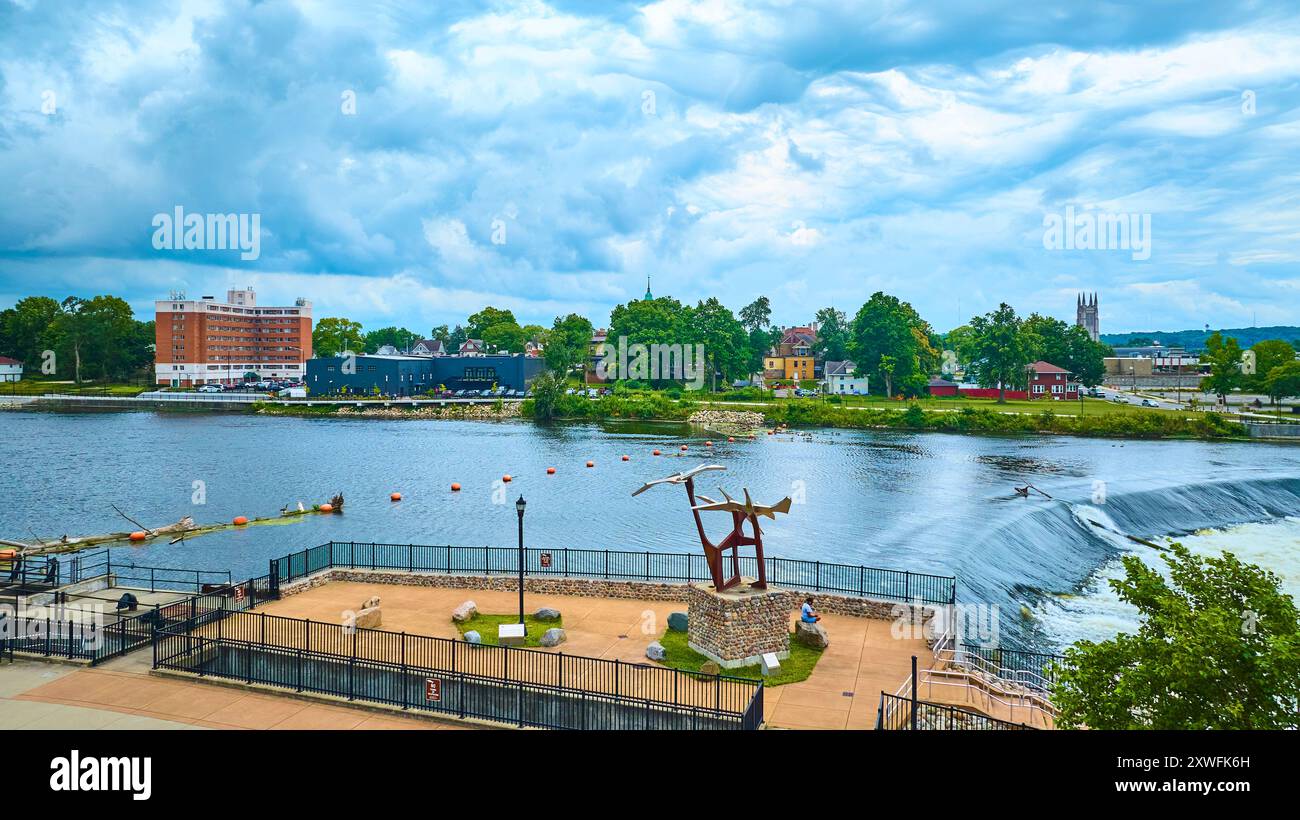 Aerial View of Riverside Park with Bird Sculpture and Calm River Flow ...