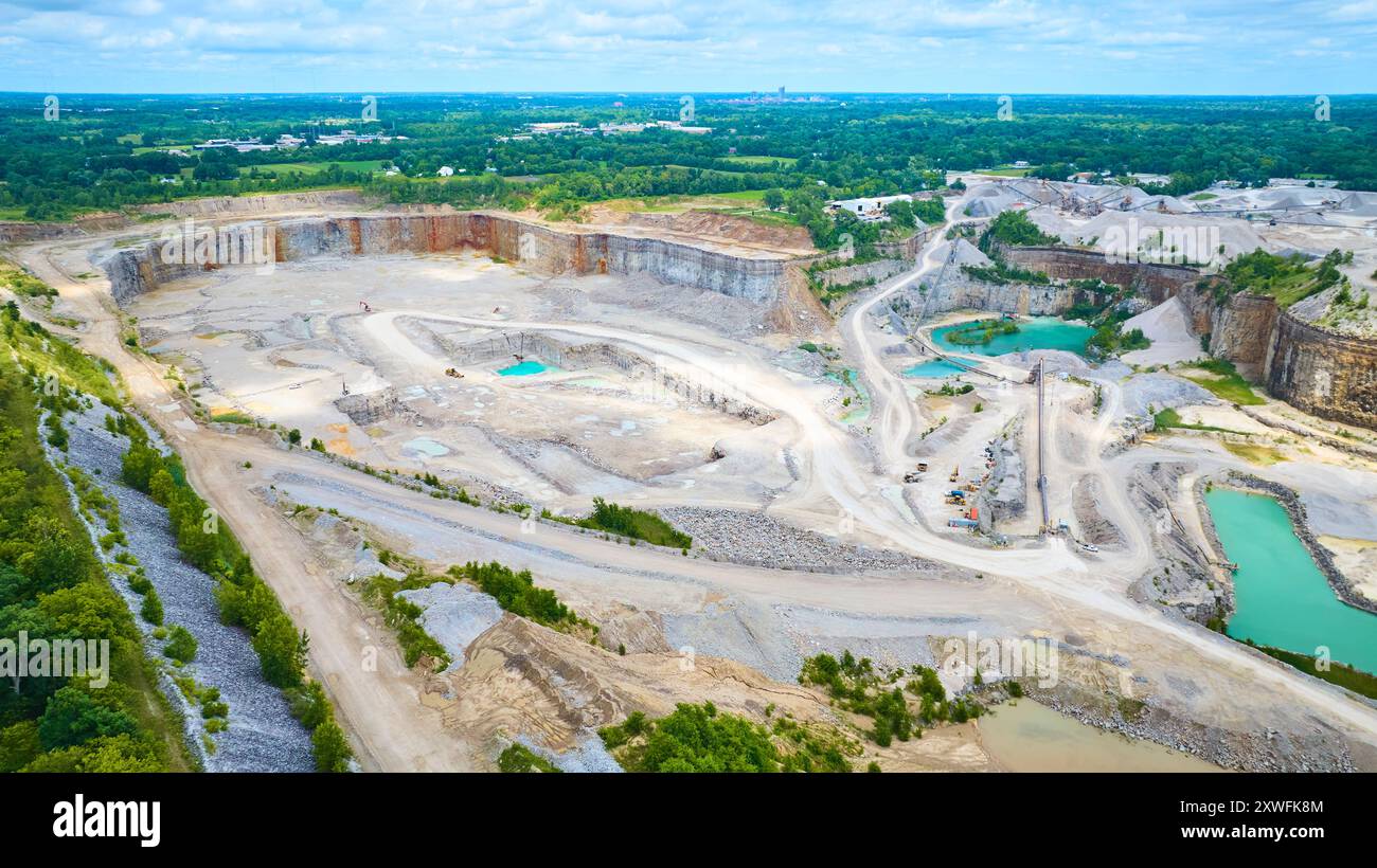 Aerial View of Quarry and Green Landscape with Construction Vehicles ...