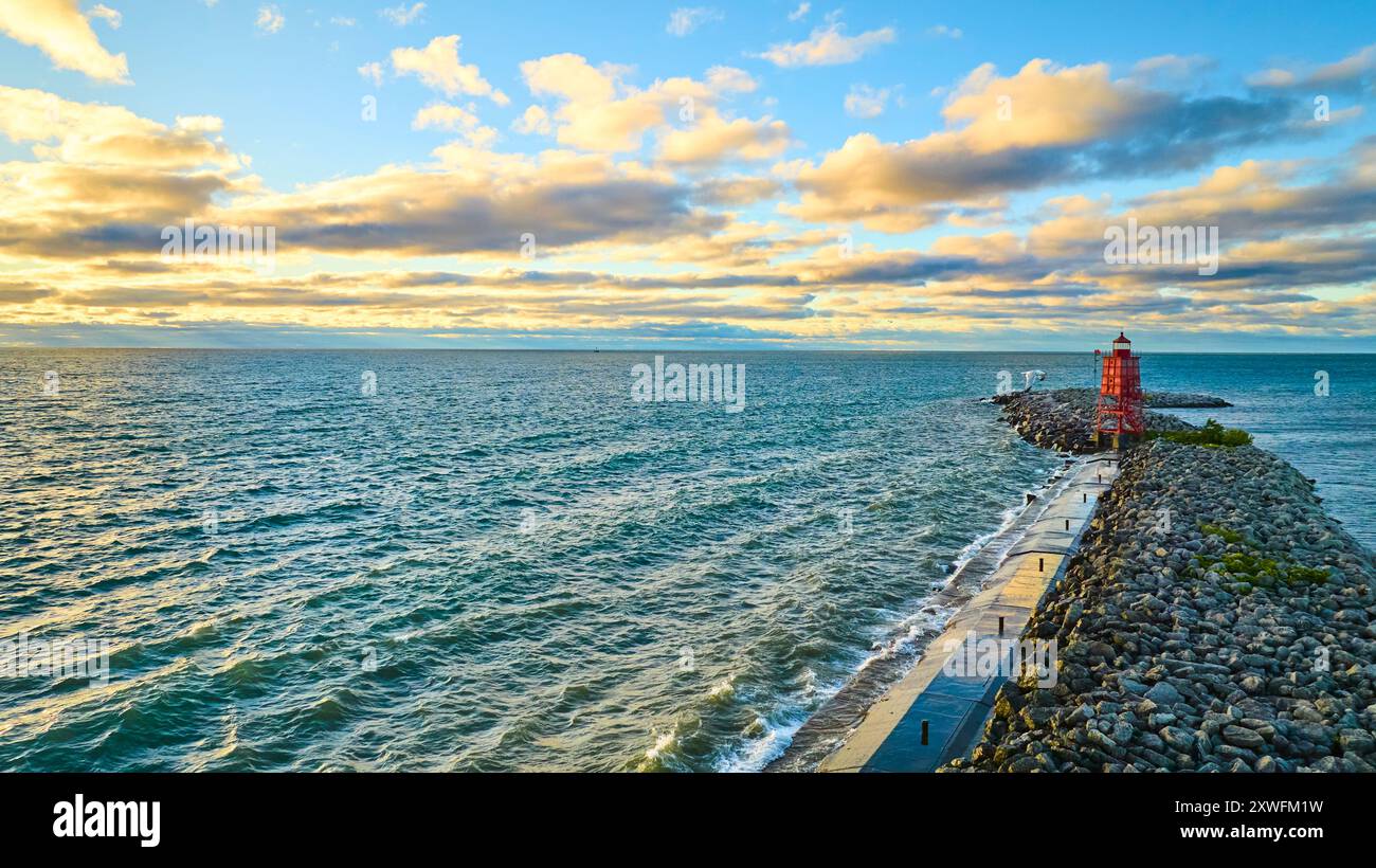 Aerial View of Red Lighthouse on Rocky Pier at Sunrise Stock Photo - Alamy