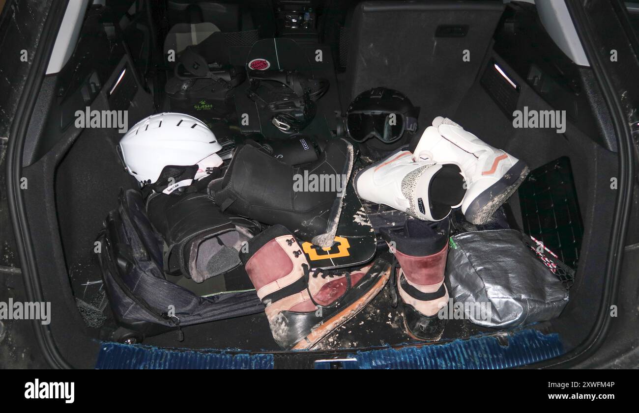 Car boot filled with snowboard equipment Stock Photo - Alamy
