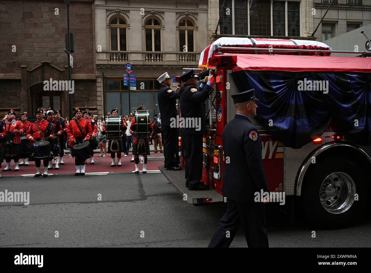 Photo by: NDZ/STAR MAX/IPx 2024 8/19/24 A firetruck carries the casket ...