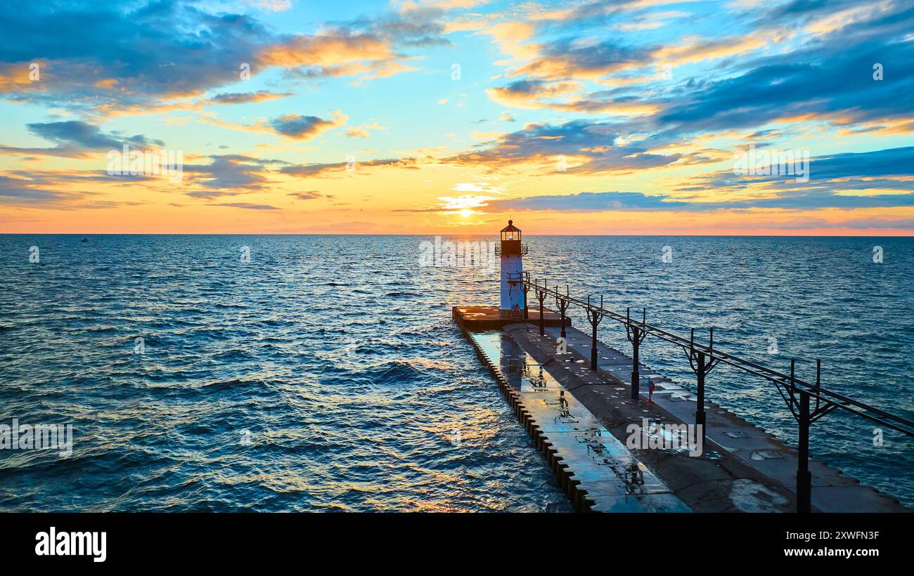 Aerial Fly Over Lighthouse and Pier at Sunset, Lake Michigan Stock ...