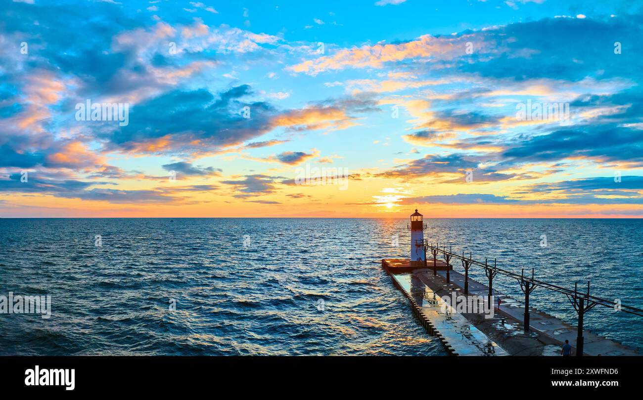 Aerial Fly Through St Joseph Lighthouse at Sunset Over Pier Stock Photo ...