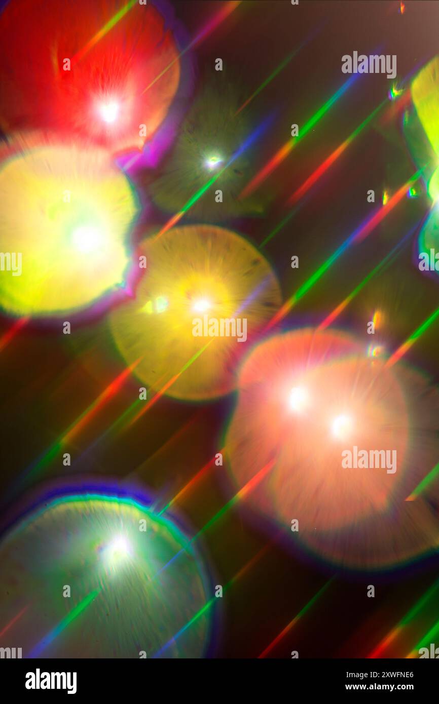 Out of focus Christmas lights, colourful with flare and rainbow colours ...