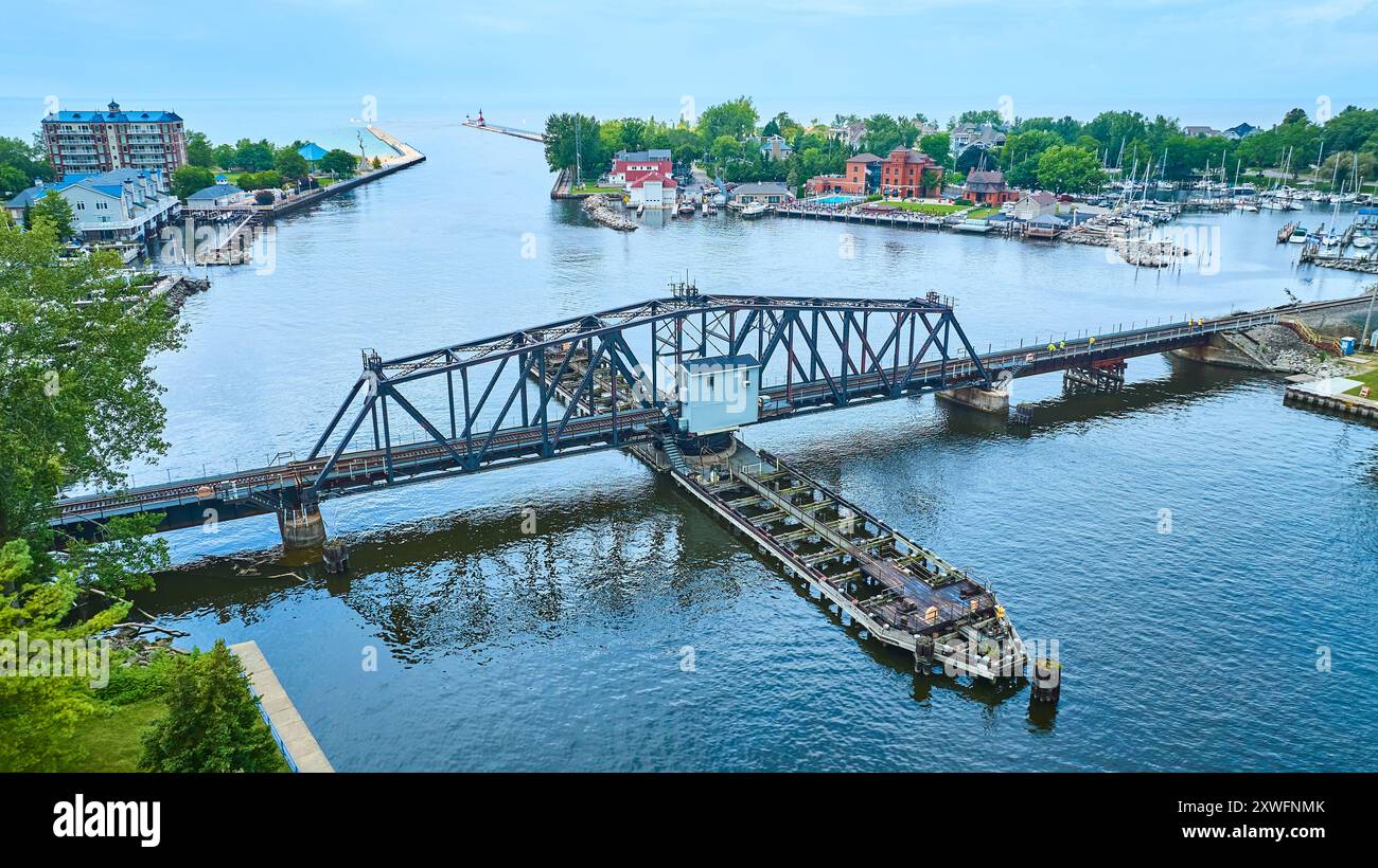 Aerial View of Steel Drawbridge and Waterfront Marina with Lush ...