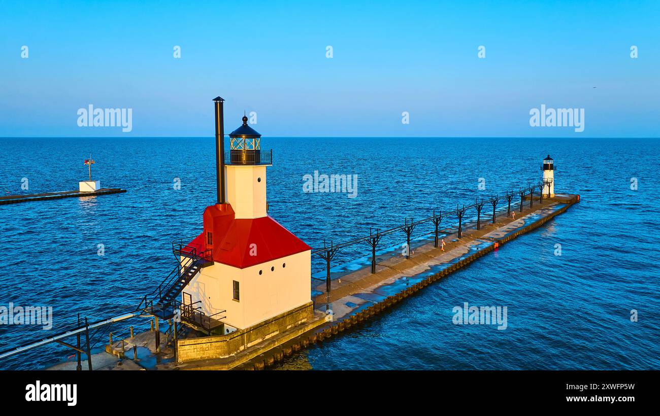 Aerial View of Twin Lighthouses on Pier at Sunrise Stock Photo - Alamy