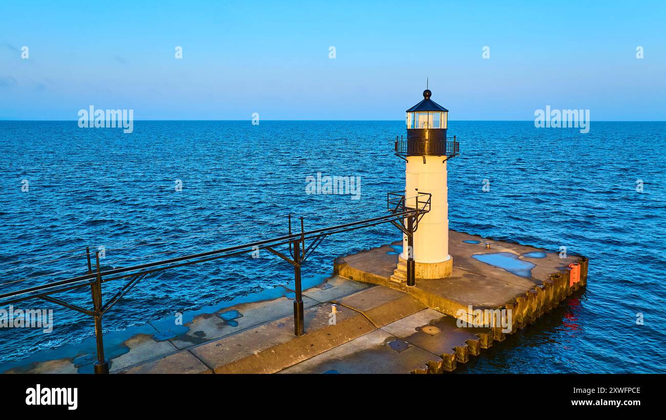 Aerial View of White Lighthouse on Concrete Pier During Golden Hour ...