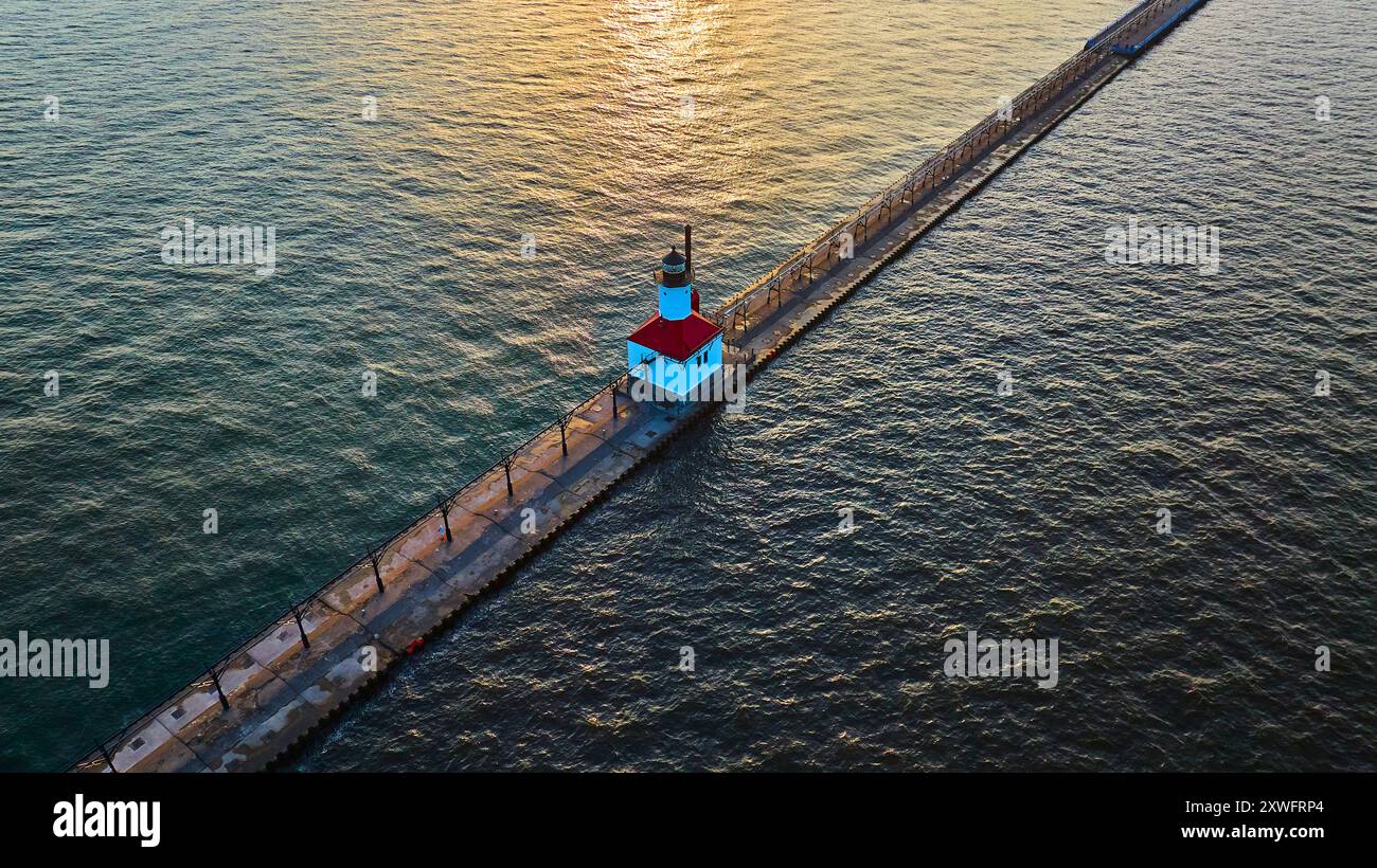 Aerial View of Lighthouse on Pier at Golden Hour Stock Photo - Alamy