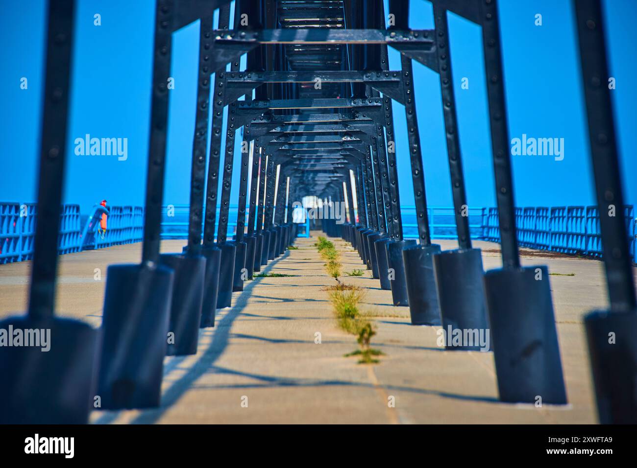 Industrial Pier Structure with Blue Railings Perspective Stock Photo ...