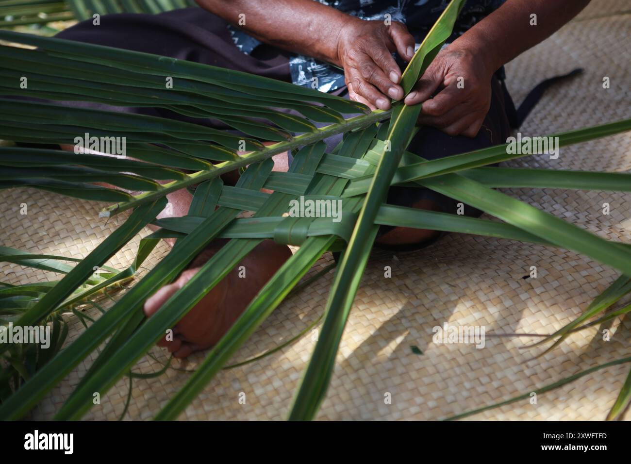 Fijian traditional basket weaving from palm leaves, men's basket ...