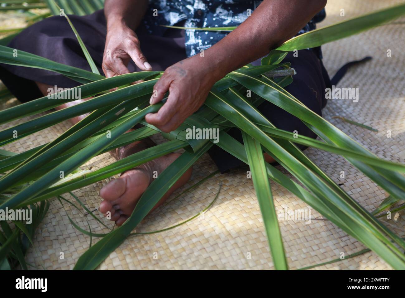 Fijian traditional basket weaving from palm leaves, men's basket ...