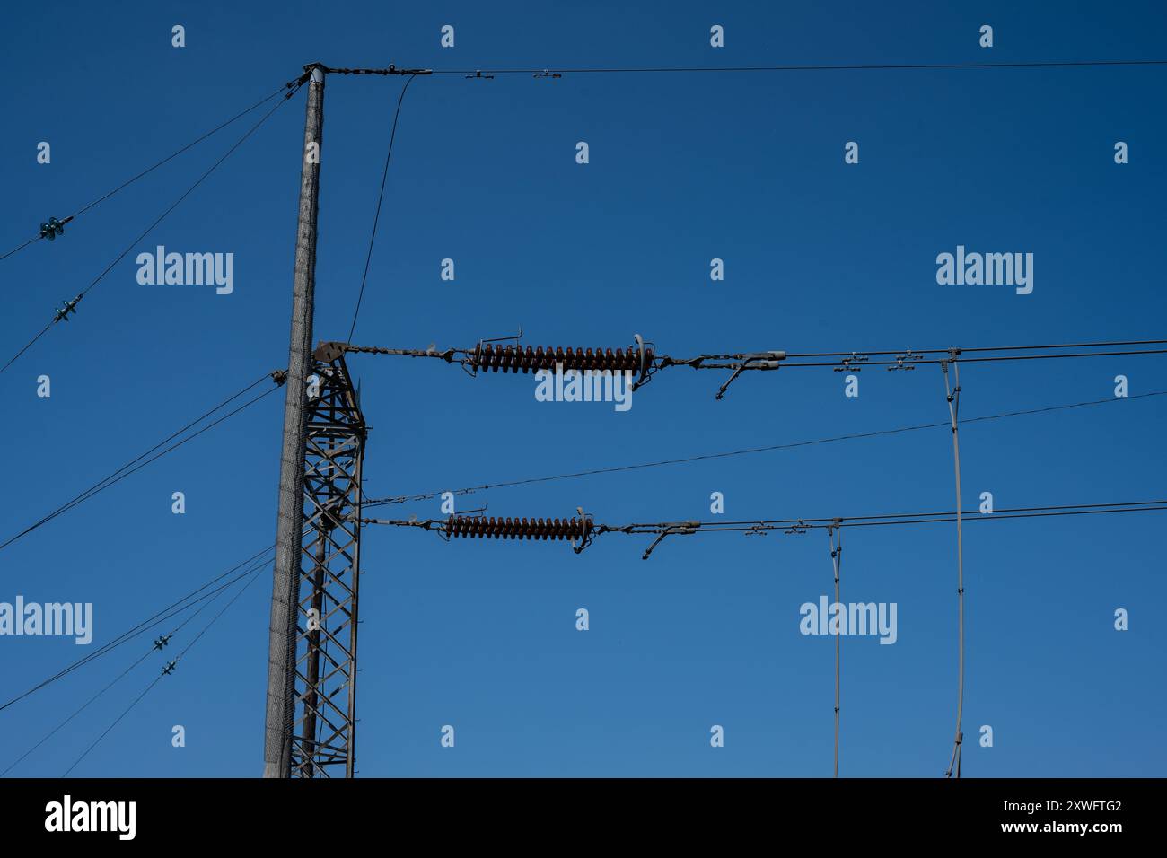 High power lines terminating to a ground station Stock Photo - Alamy