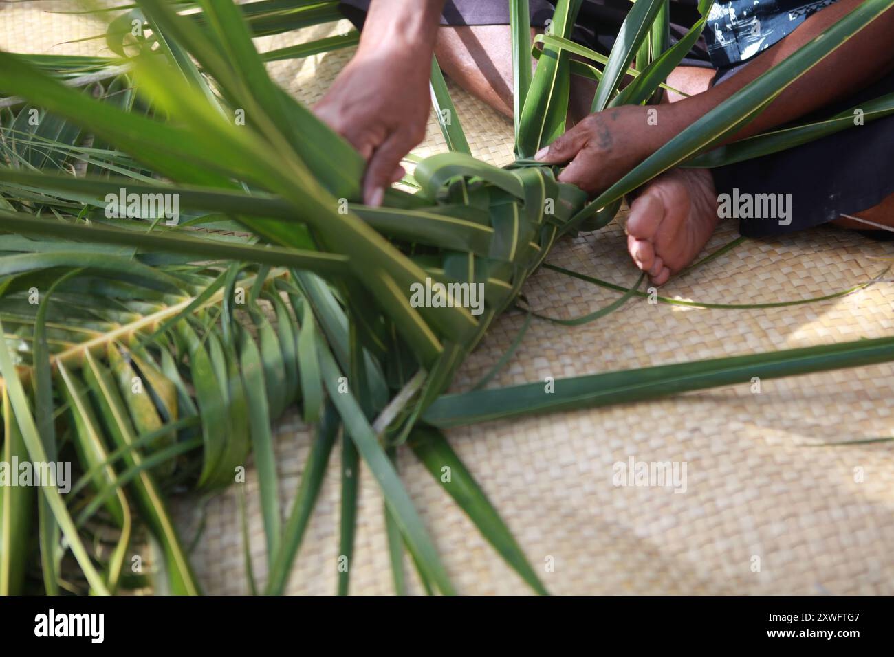 Fijian traditional basket weaving from palm leaves, men's basket ...