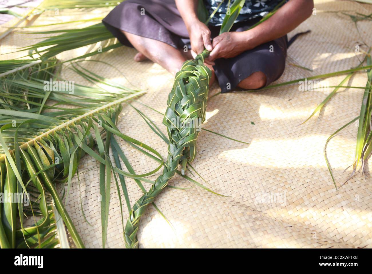 Fijian traditional basket weaving from palm leaves, men's basket ...