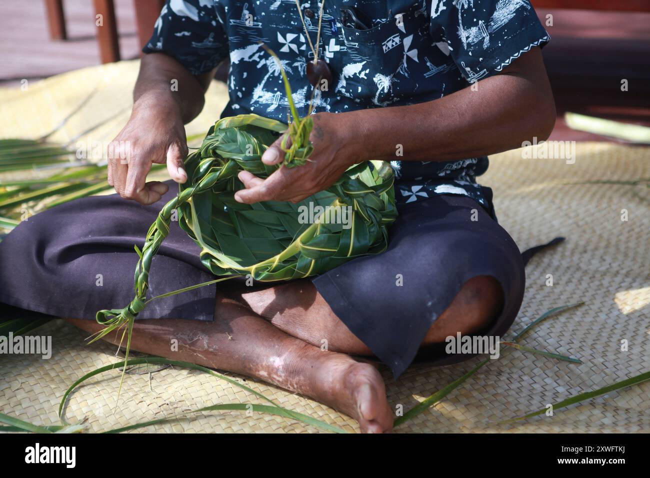 Fijian traditional basket weaving from palm leaves, men's basket ...