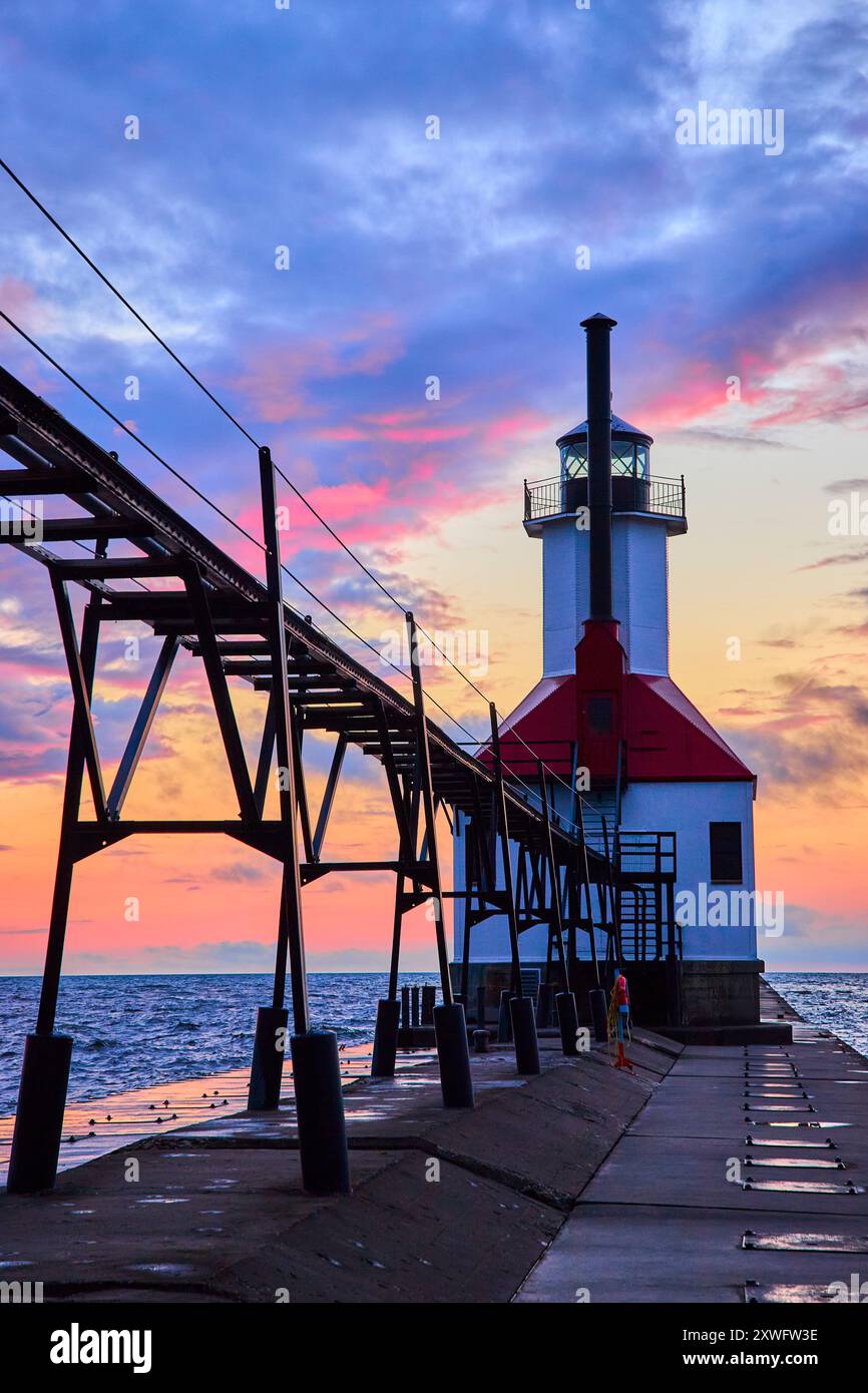 Lake Michigan Lighthouse at Sunset from Pier Perspective Stock Photo ...