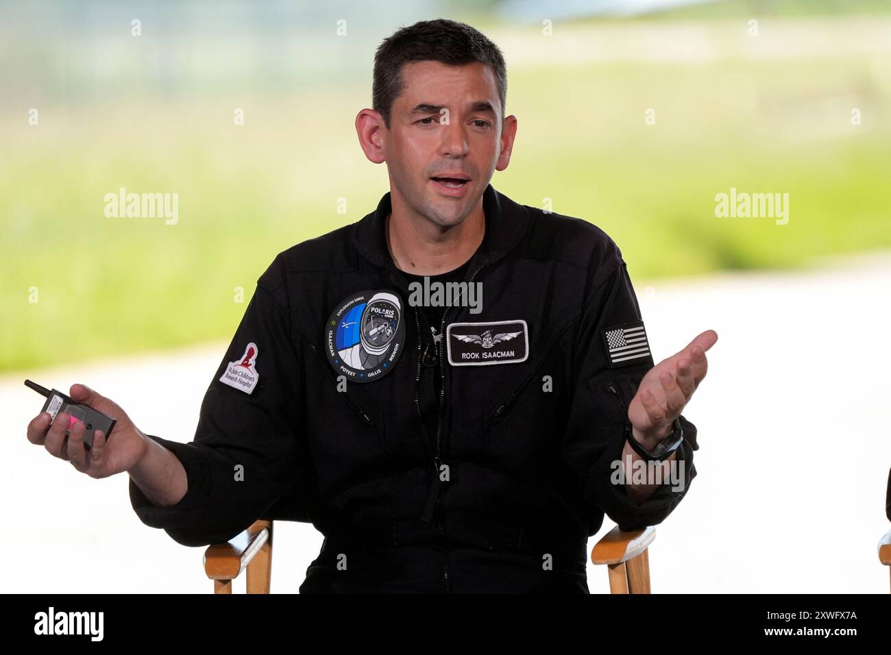 Commander Jared Isaacman speaks at a news conference after arriving at ...