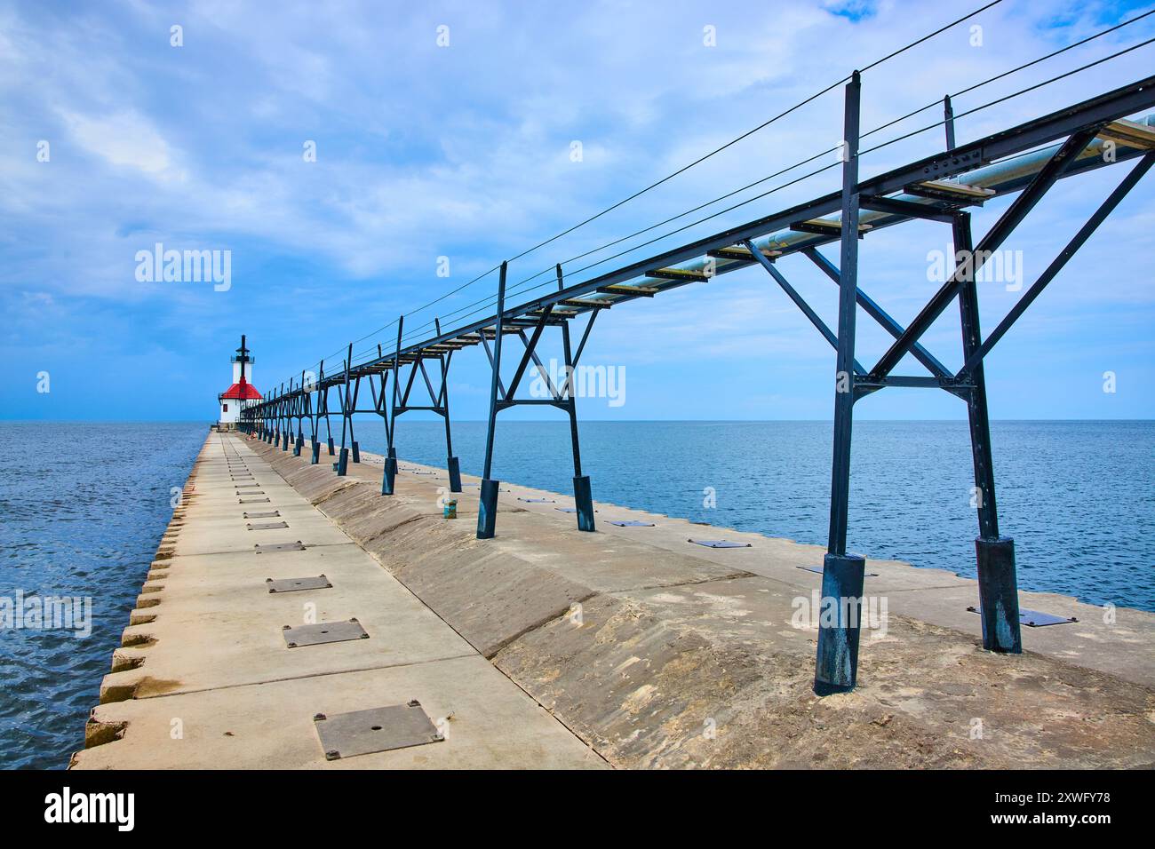 Lighthouse and Pier on Lake Michigan Low Angle Perspective Stock Photo ...
